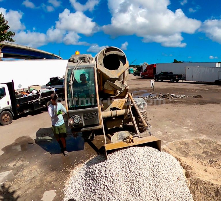 Carmix pouring concrete at commercial truck parking and repair shop ...